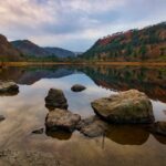 Glendalough Lake surrounded by autumn foliage in County Wicklow Ireland