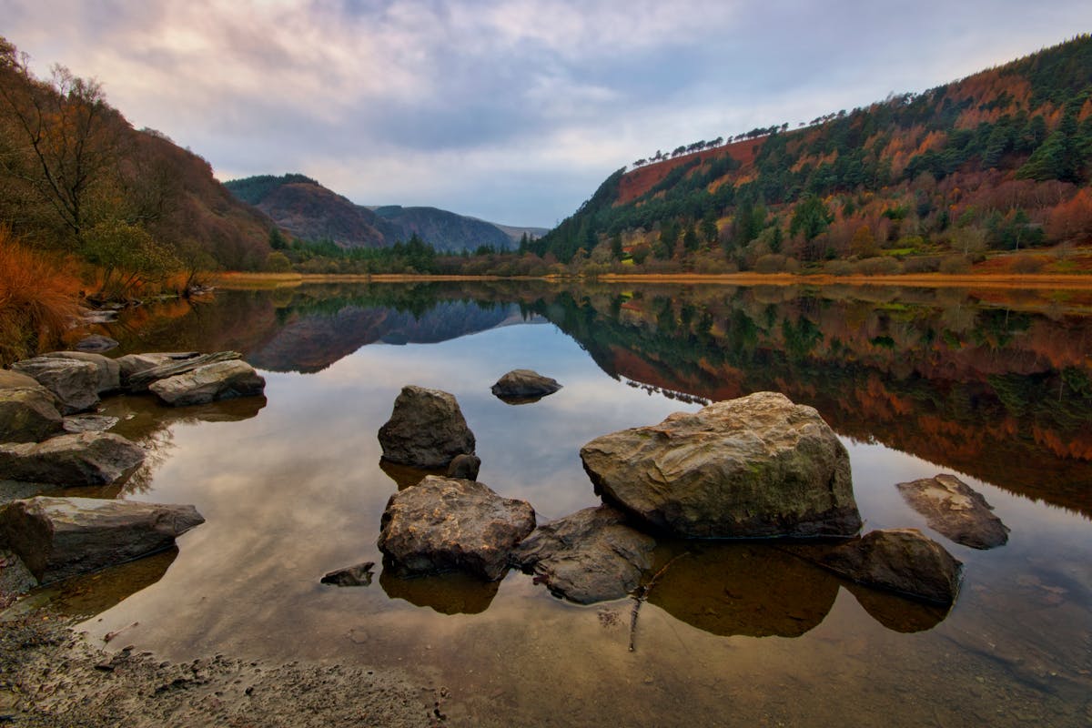 Glendalough Lake surrounded by autumn foliage in County Wicklow Ireland