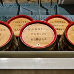 Wooden barrels labeled Guinness Dublin in the Storehouse museum