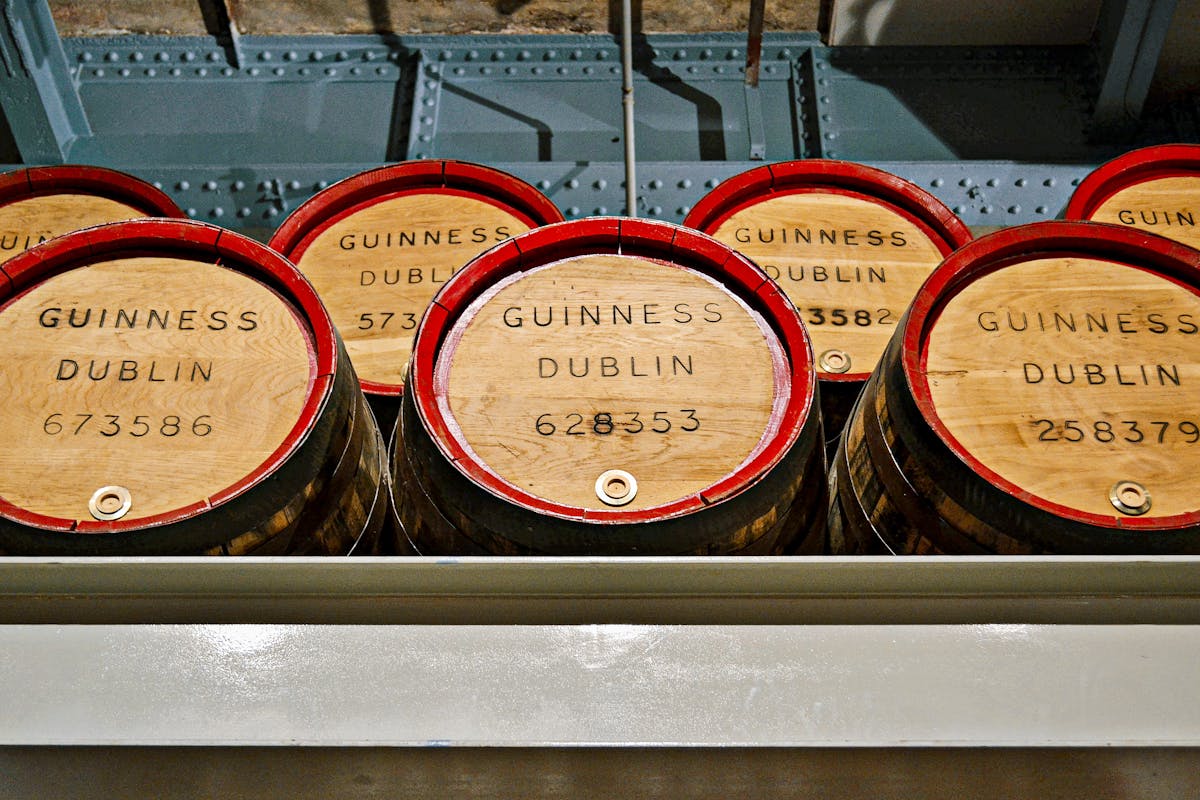 Wooden barrels labeled Guinness Dublin in the Storehouse museum