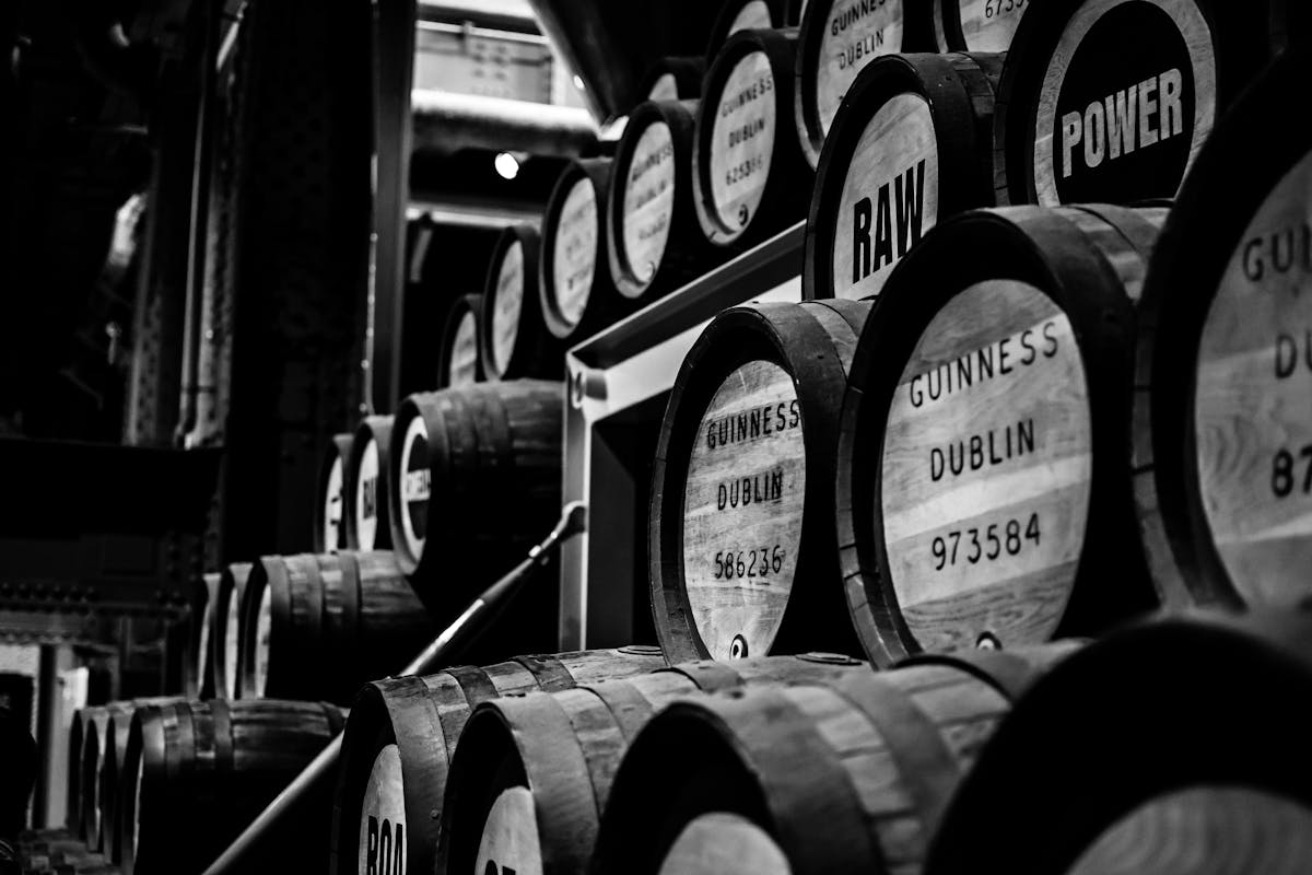 Monochrome image of Guinness barrels stacked in the Dublin brewery