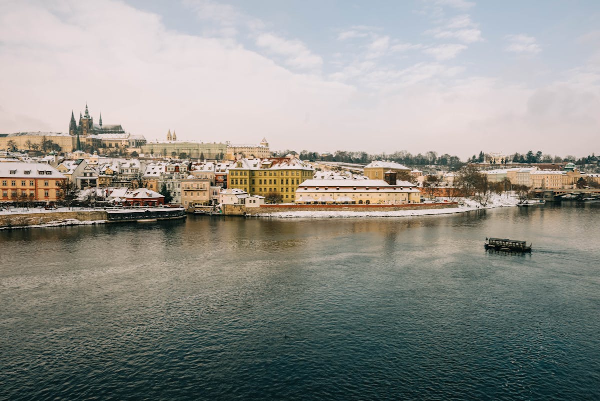 Picturesque winter view of Prague iconic riverside and architecture under snow
