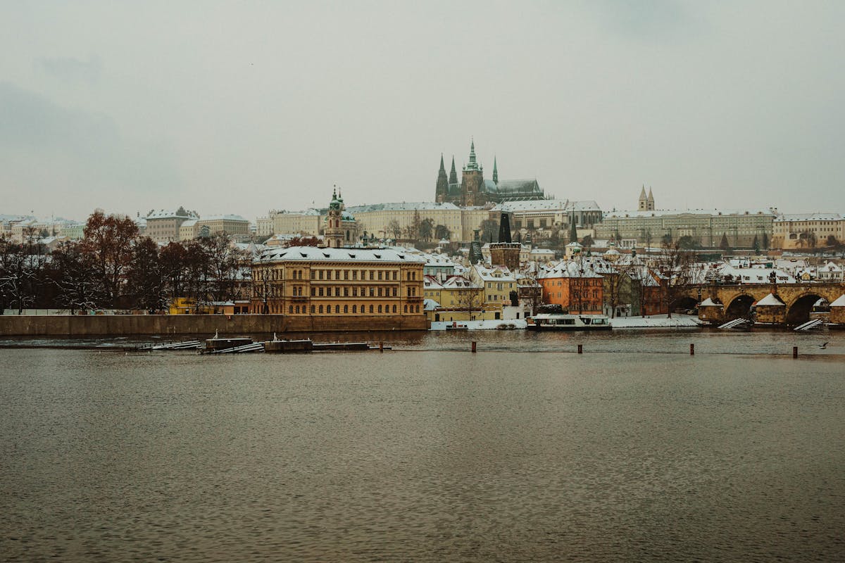 Beautiful winter view of Prague Castle and Charles Bridge after snowfall