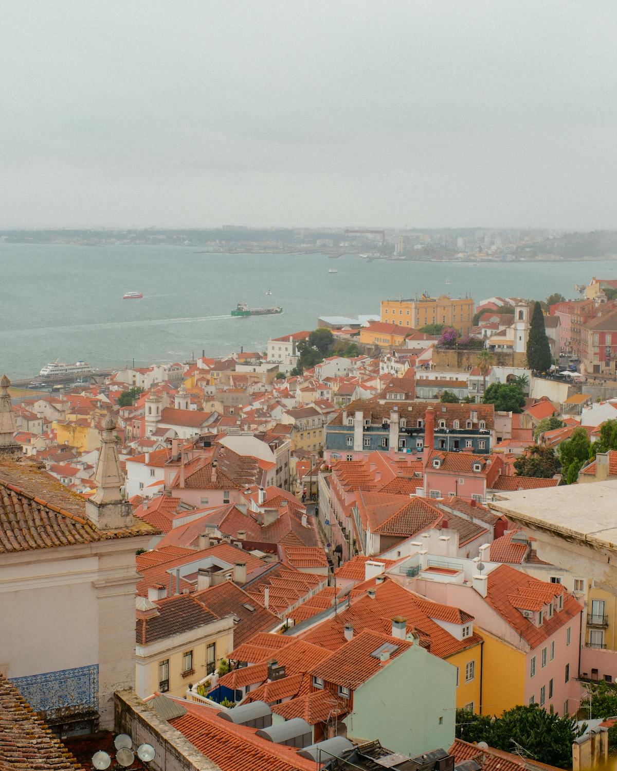 Scenic view over Lisbon old town with terracotta rooftops and church towers