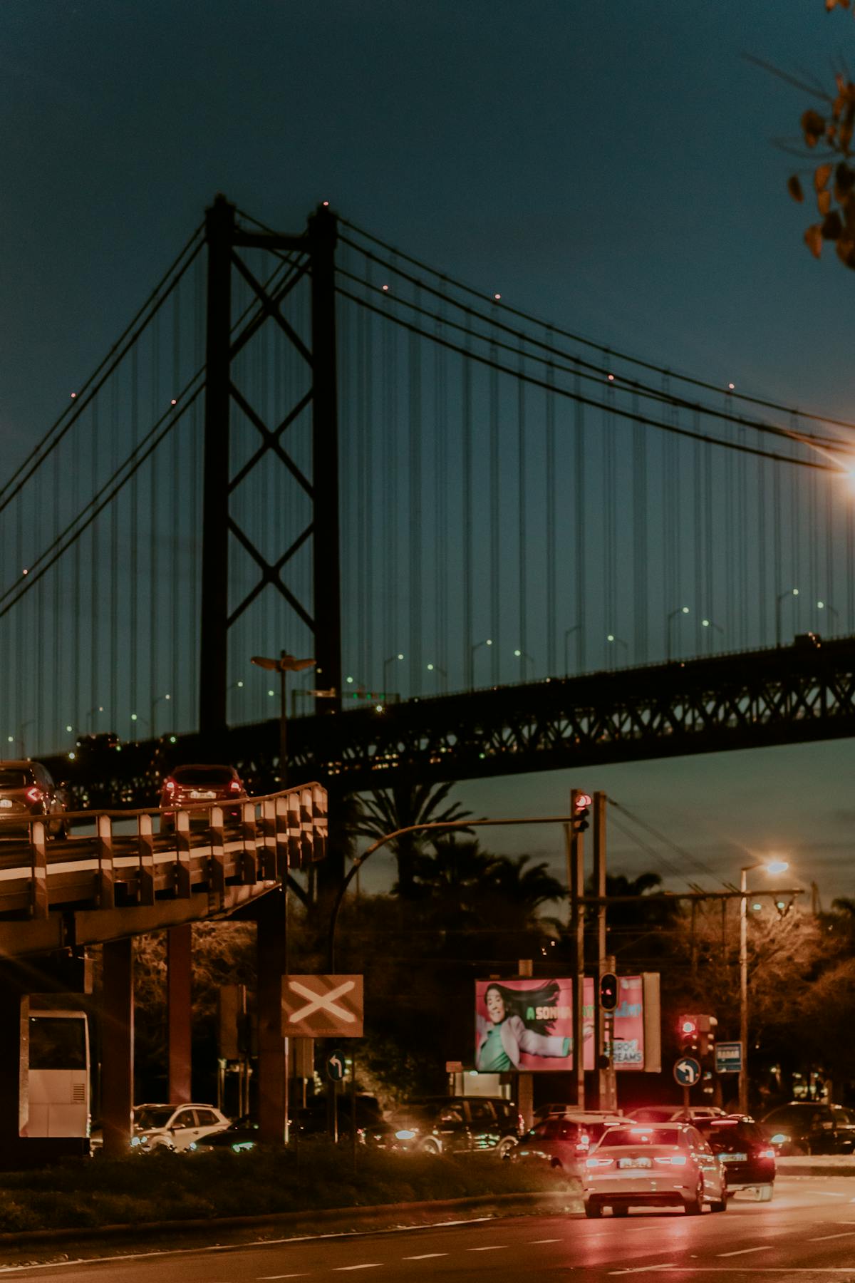 The 25 de Abril suspension bridge spanning the Tagus river in Lisbon at golden hour