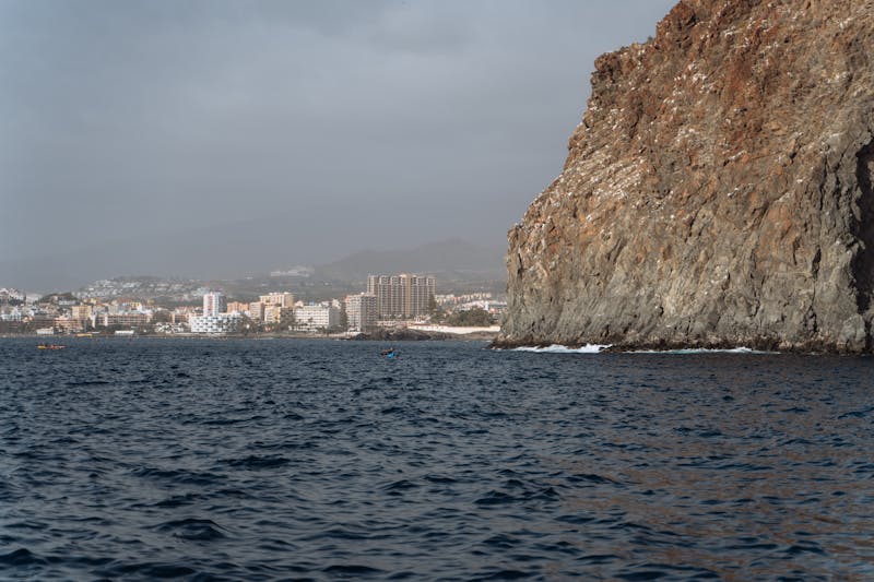Dramatic coastal view of Los Cristianos in Tenerife with ocean and cliffs