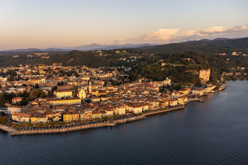 Aerial photograph of the town of Arona on the shores of Lake Maggiore during sunset