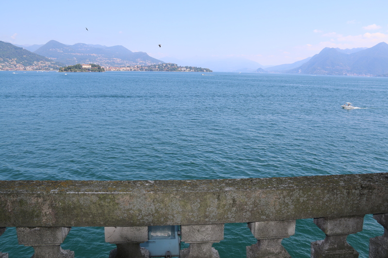 The ornate Baroque terraced gardens of Isola Bella with the palace and Lake Maggiore visible