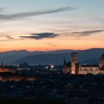 Florence skyline at sunset showing the Duomo dome and Palazzo Vecchio tower