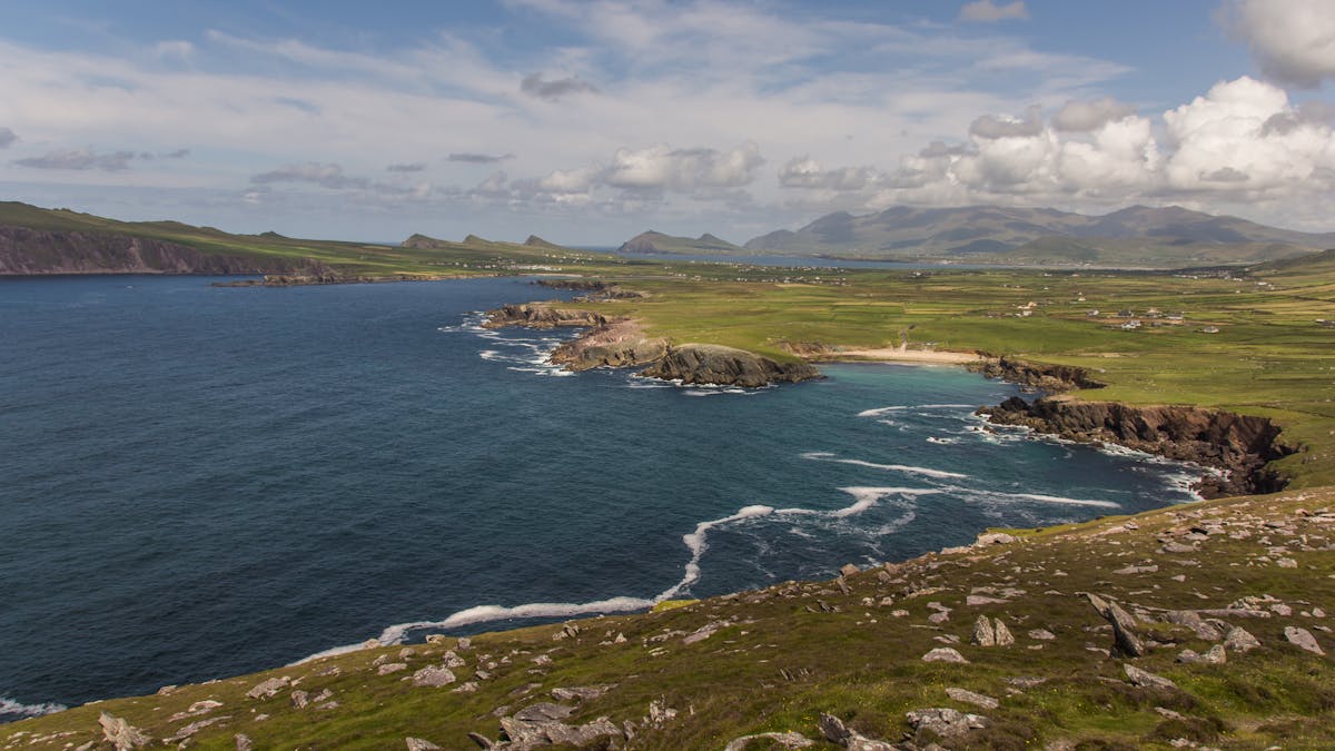 Breathtaking Dingle Peninsula coast with green landscapes and rugged cliffs