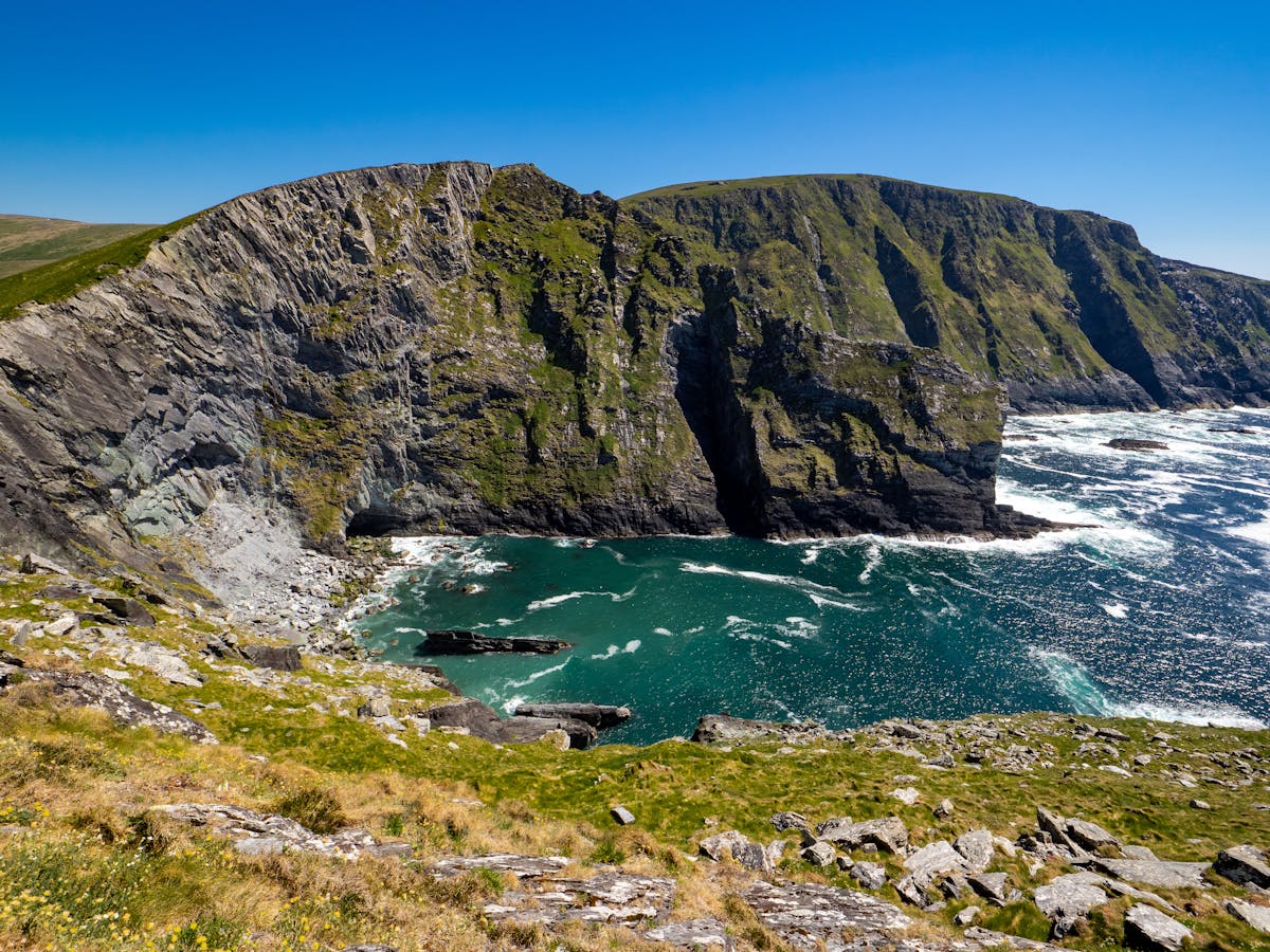 Stunning cliffs and turquoise waters along County Kerry coastline Ireland