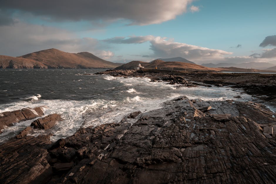 Wide sandy beach with dunes on the Kerry coast under dramatic sky