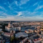 Panoramic aerial view of St Peters Basilica and the Vatican City skyline at sunset