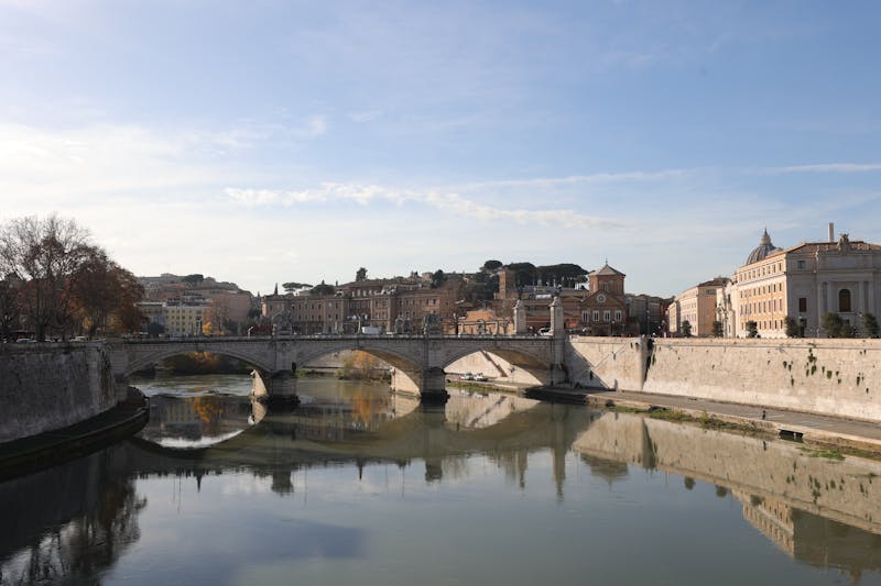 The Ponte Sant Angelo bridge over the Tiber River with historic statues in Rome