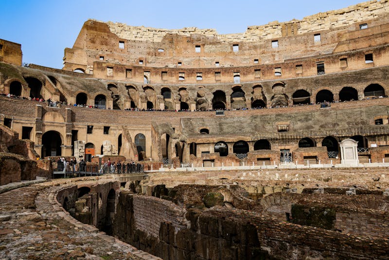 Interior view of the Colosseum showing ancient stone ruins and arched passages