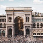 Crowded scene at Galleria Vittorio Emanuele II in Milan showing the grand glass-roofed arcade