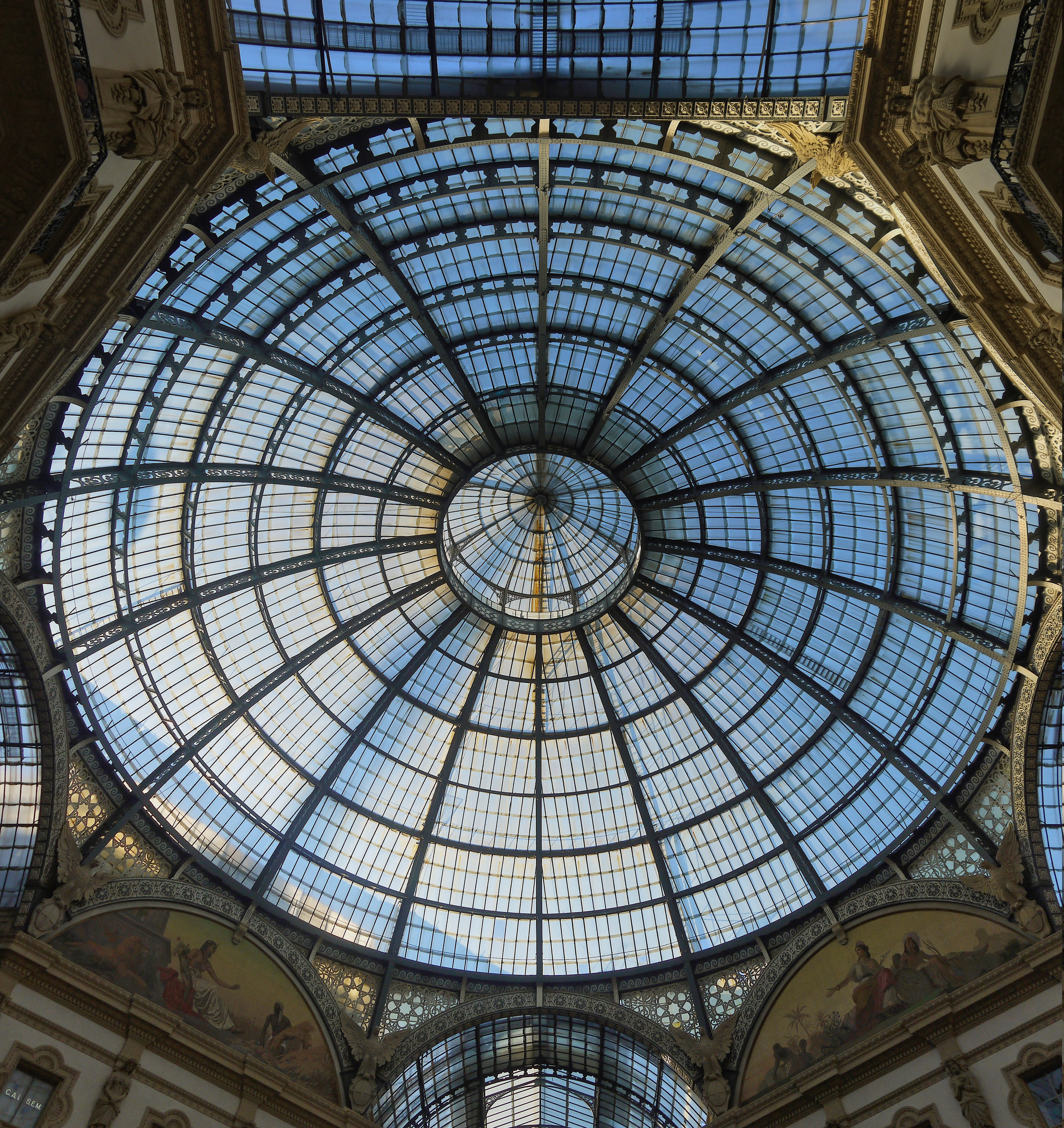 The ornate glass and iron dome of Galleria Vittorio Emanuele II in Milan