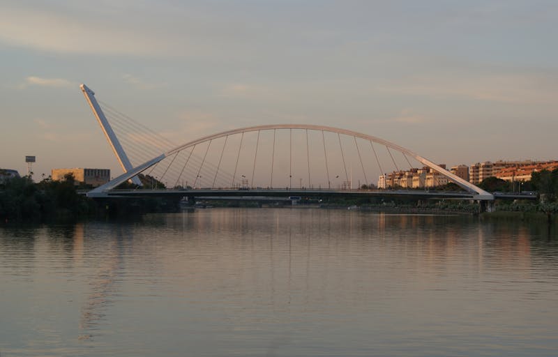 Evening view of La Barqueta Bridge over the Guadalquivir river in Seville Spain