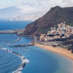 Aerial view of Playa de las Teresitas golden sand beach with mountains and ocean in Tenerife