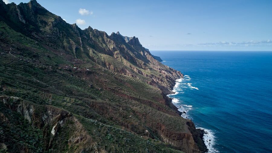 Dramatic green cliffs and coastline meeting the Atlantic Ocean in Tenerife