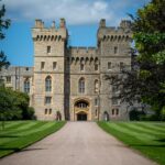 Windsor Castle entrance with manicured green lawns and clear sky