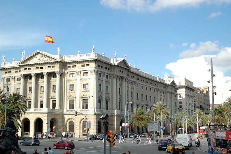 Neoclassical building in Barcelona showcasing Spanish architecture with street scene