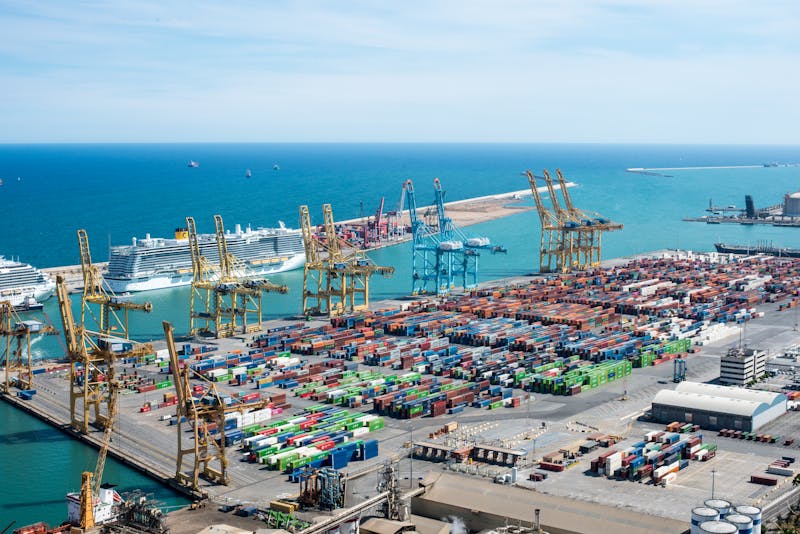 Aerial view of Barcelona port showing cranes and cruise ships