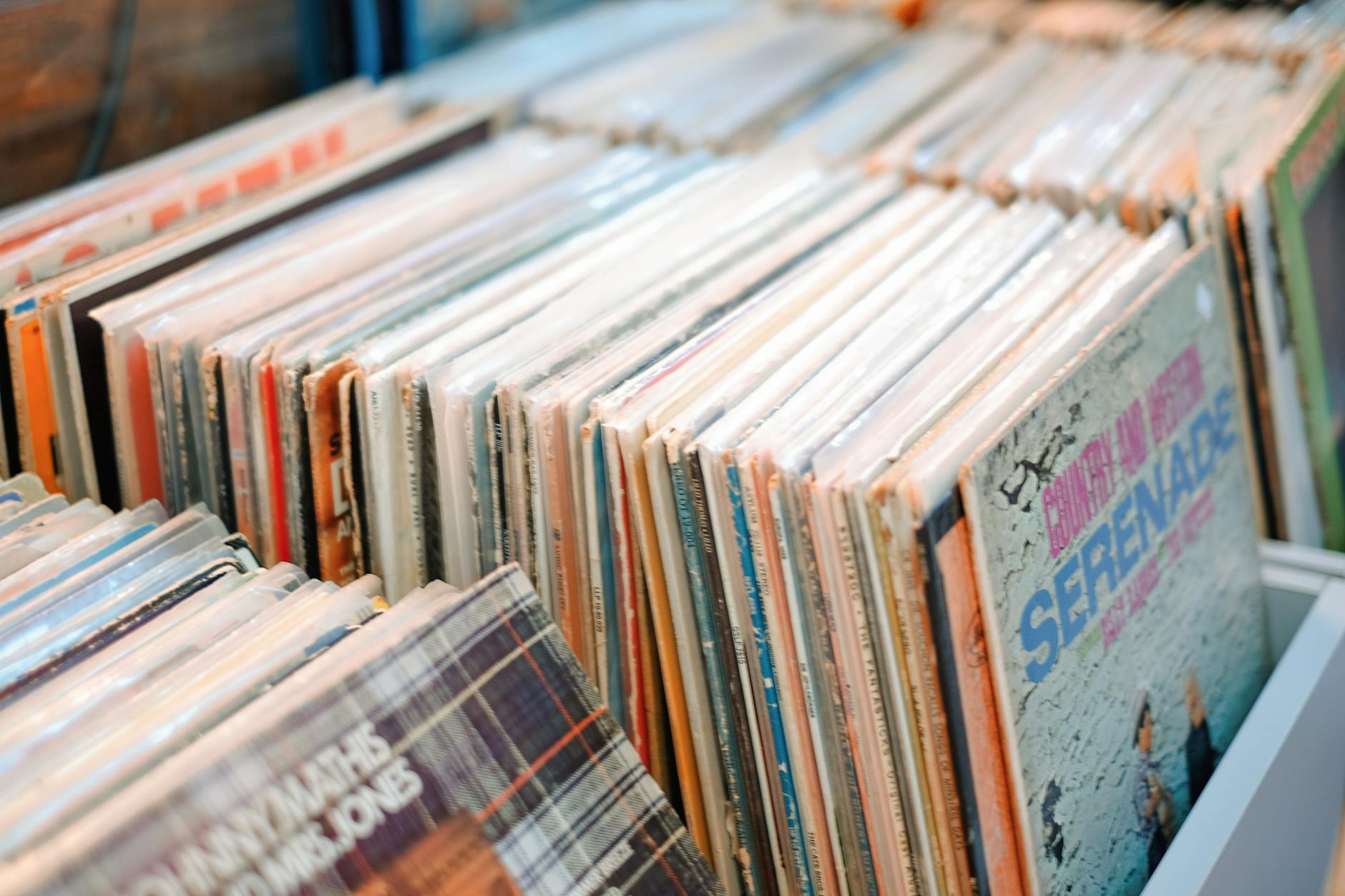 Vintage vinyl records showcasing retro album art in a store