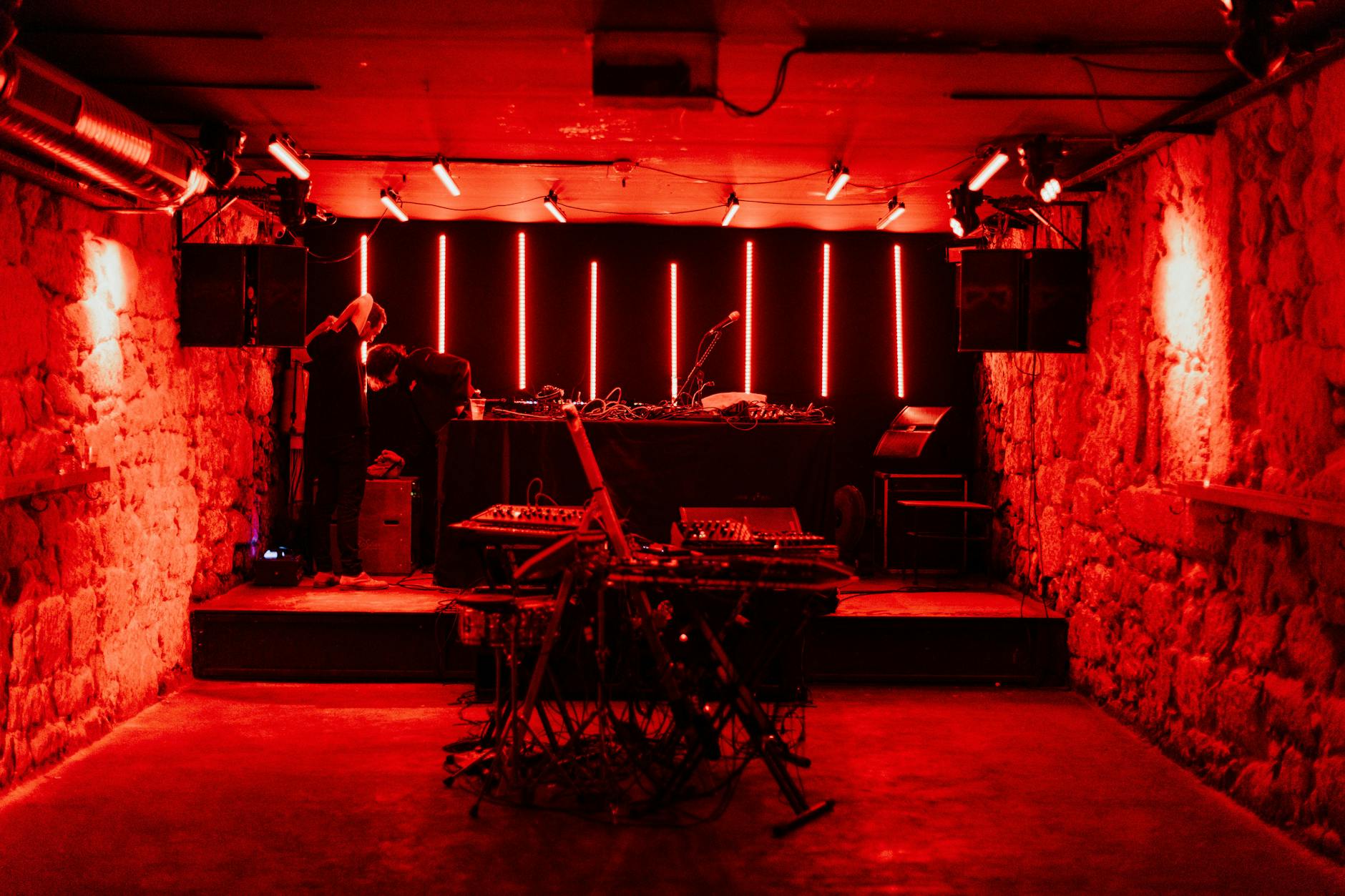 Underground music venue with atmospheric red lighting