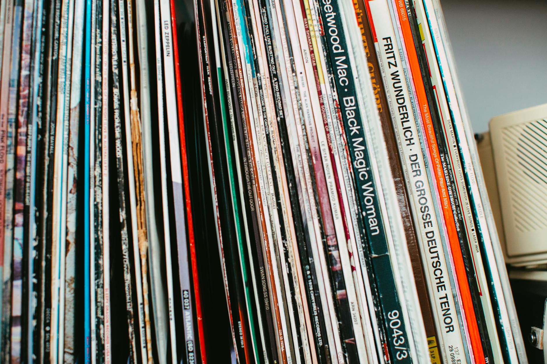 Stack of classic vinyl records neatly arranged on a shelf