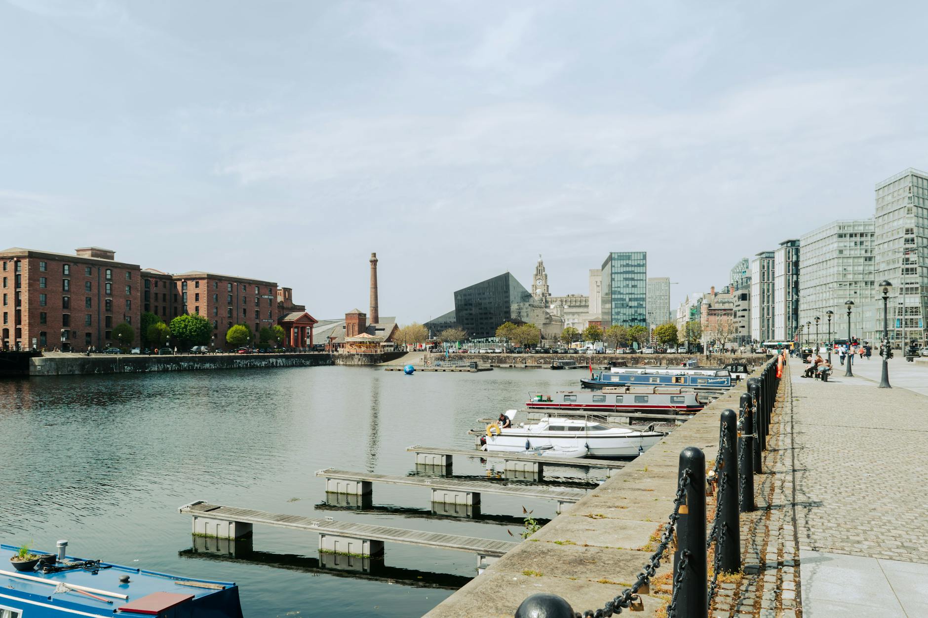 Liverpool waterfront with docked boats and city architecture