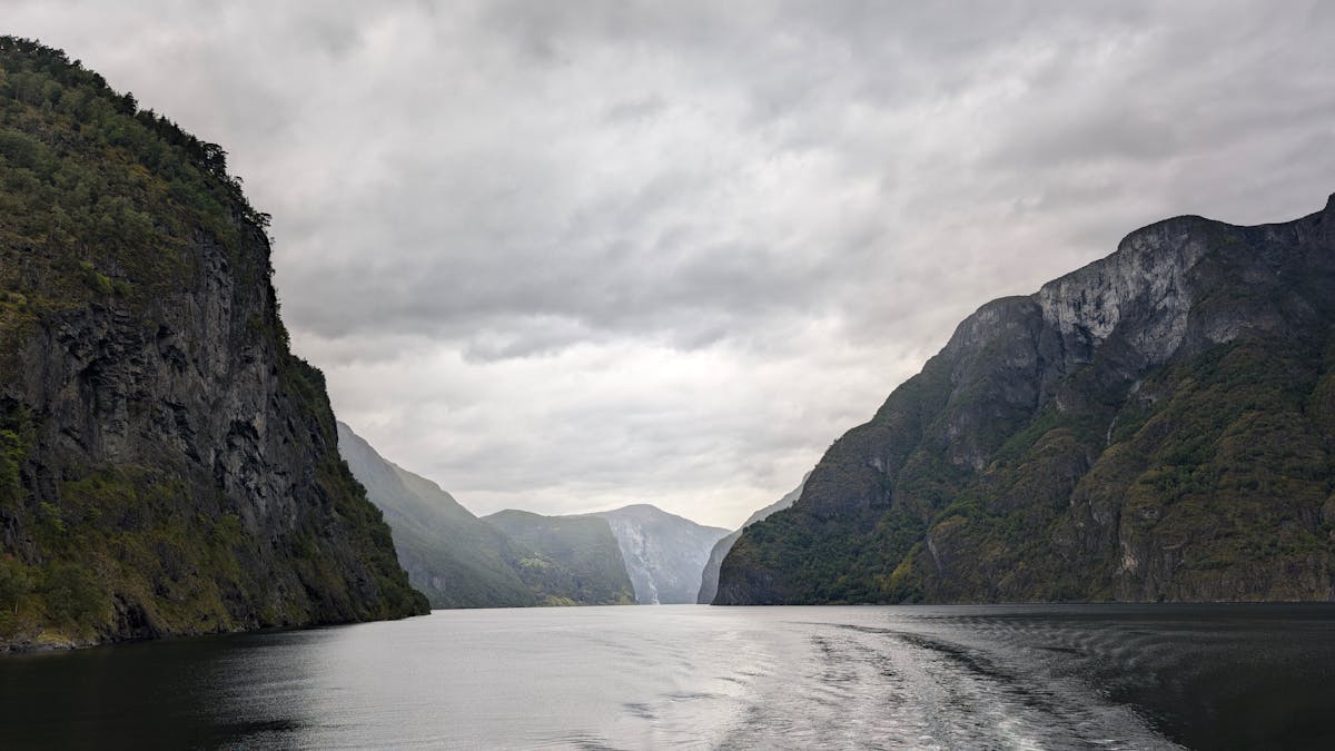 Norwegian fjord near Bergen with dramatic clouds overhead