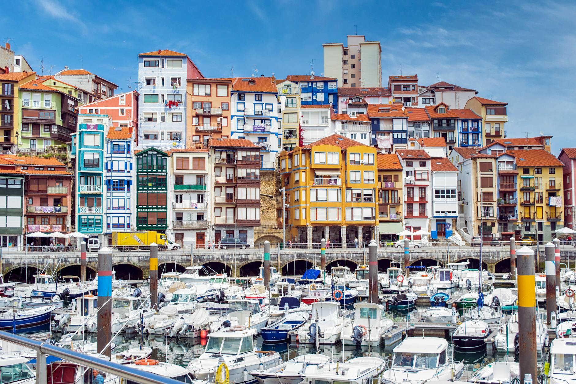 Colorful apartment buildings overlooking the fishing boat harbor of Bermeo in Basque Country Spain