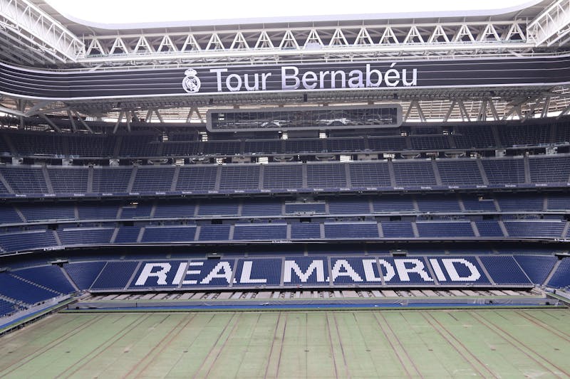Panoramic interior view of the renovated Santiago Bernabeu Stadium showing the full pitch and tiered stands