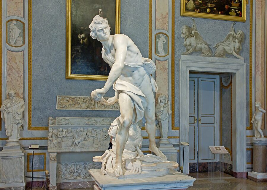 Side view of David by Bernini from 1623-1624 in the Galleria Borghese showing the tense posture before throwing