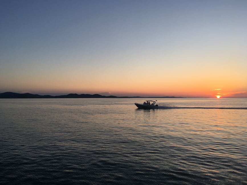 Speedboat cruising the calm Adriatic Sea at sunset