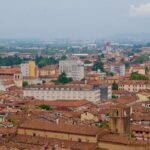 Aerial view of Bologna Italy showing terracotta rooftops and historic architecture
