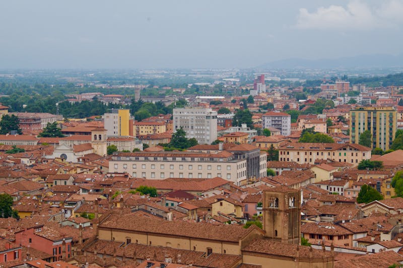 Aerial view of Bologna Italy showing terracotta rooftops and historic architecture