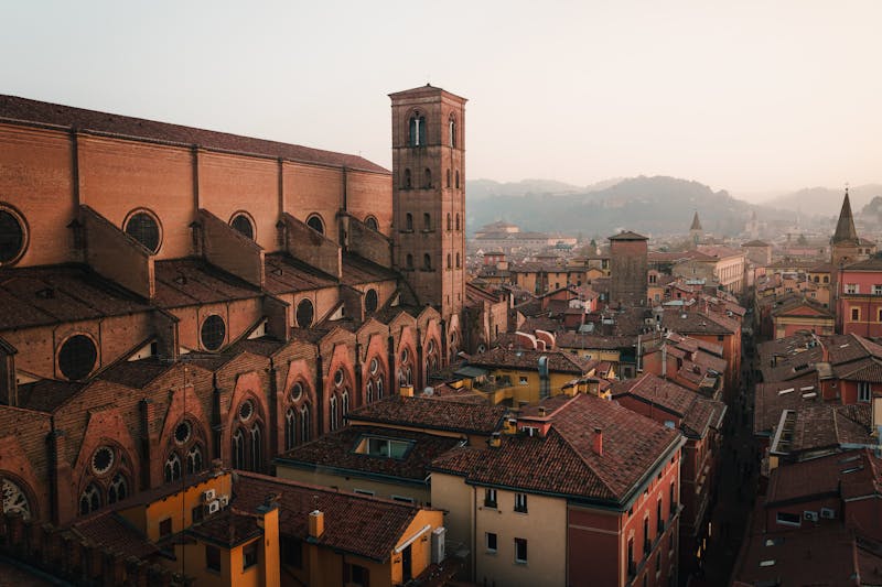Aerial view of Bologna historic architecture illuminated at dusk