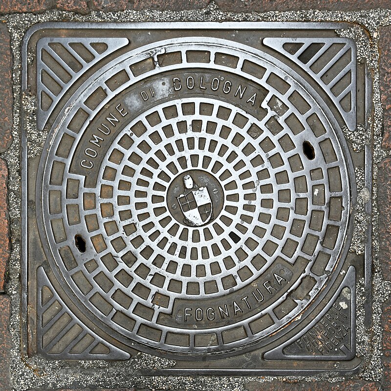 The narrow streets of the Quadrilatero market district in Bologna with food shops