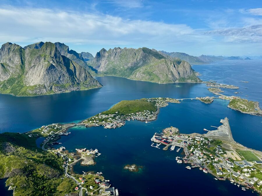Explore the stunning aerial view of Lofoten Islands showcasing mountains, sea, and serene landscapes