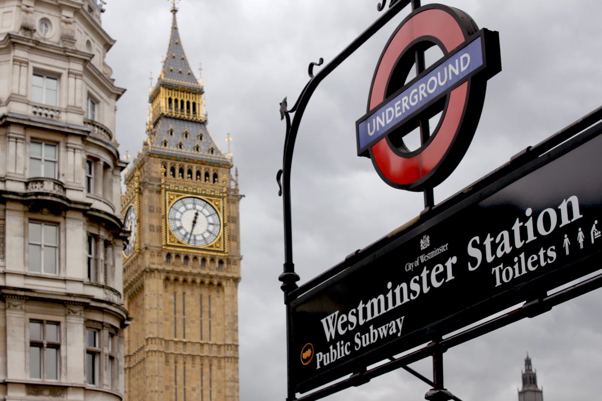 View of Big Ben and Westminster Station sign in London England capturing iconic British landmarks