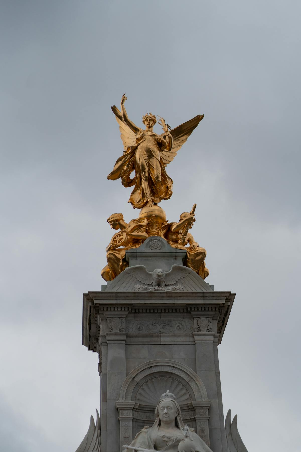 Low angle view of the iconic Victoria Memorial with golden statues in London England