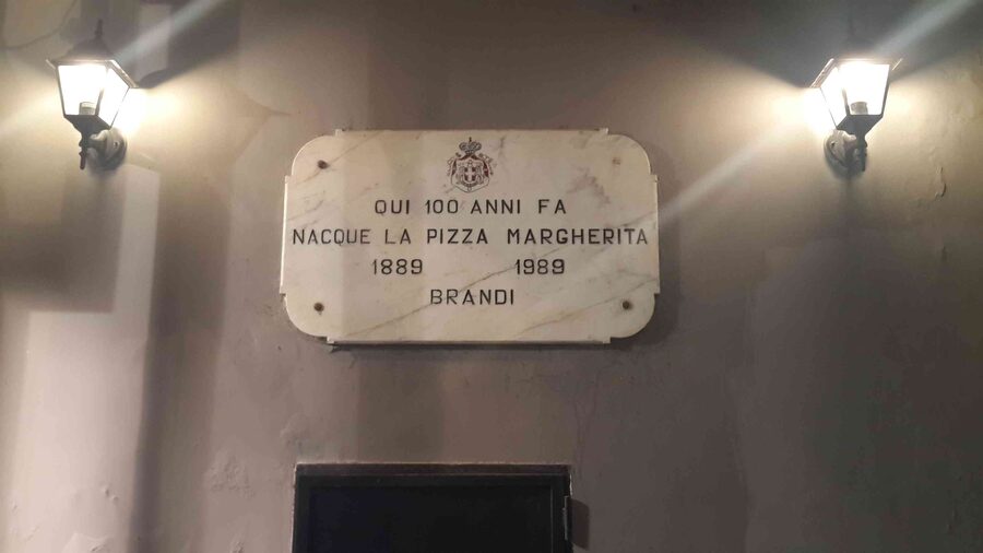 Commemorative plaque at Pizzeria Brandi in Naples marking the birthplace of Pizza Margherita