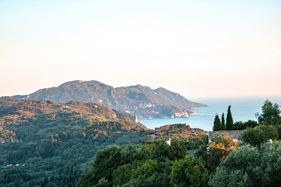 Breathtaking landscape view of Korfu, Greece, showcasing lush greenery and the Mediterranean Sea.