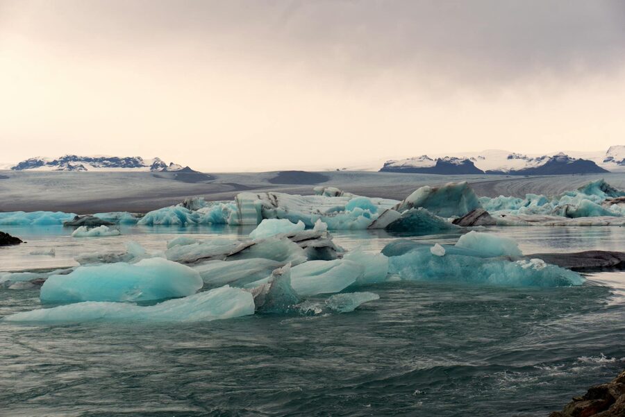 Breathtaking view of icebergs floating in the serene Jokulsarlon Glacier Lagoon, Iceland.