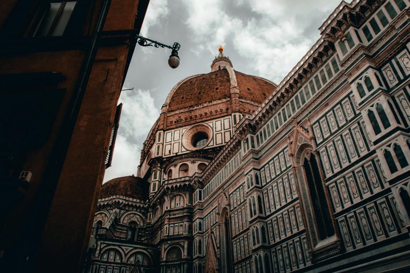 Low angle view of Brunelleschis Dome against a cloudy sky in Florence Italy