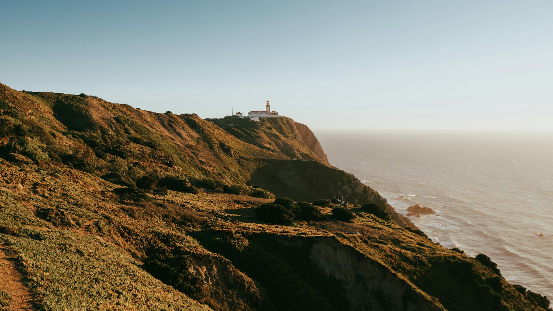 Cabo da Roca lighthouse perched on rugged cliffs overlooking the Atlantic Ocean