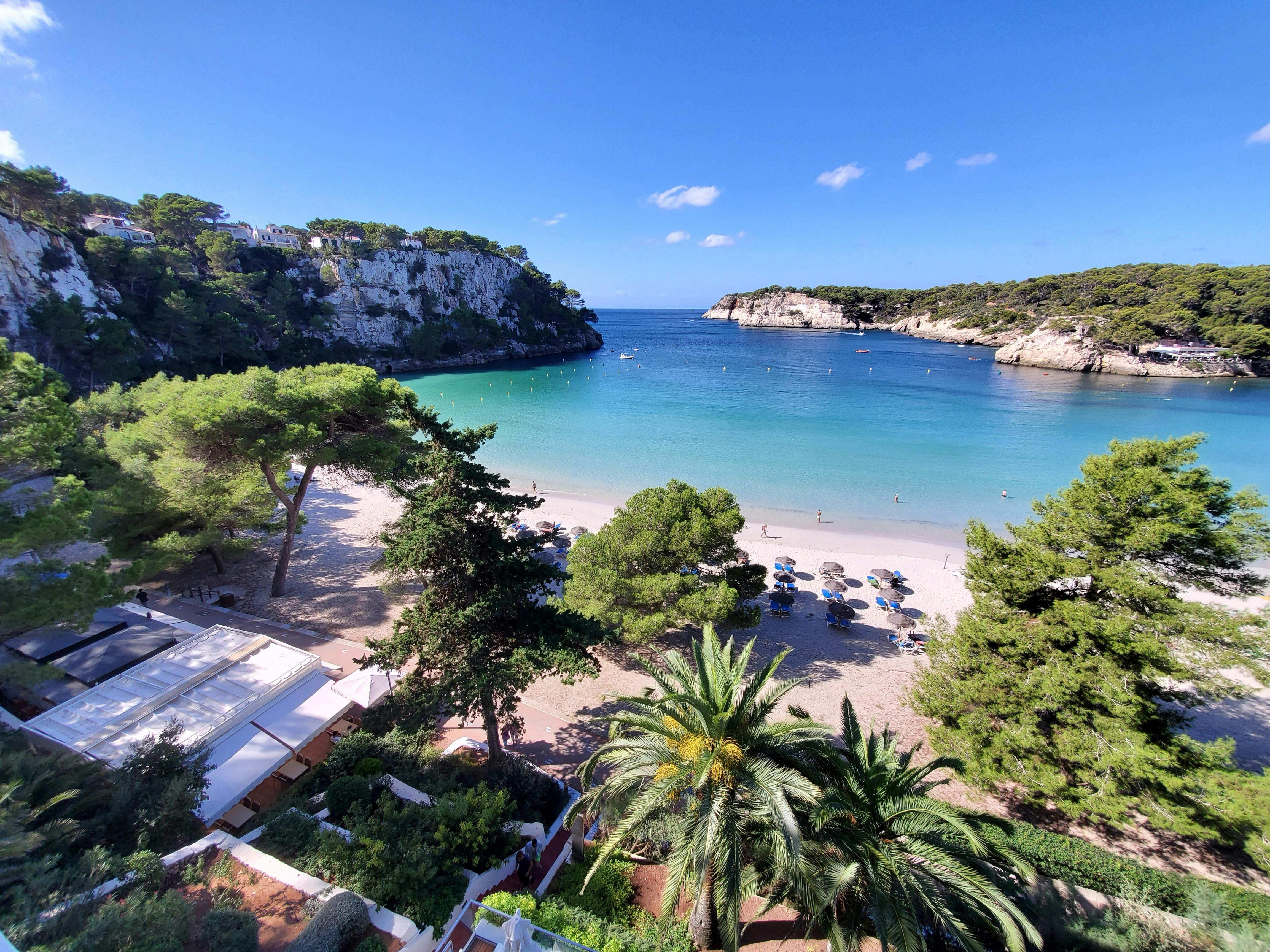Aerial view of Cala Galdana beach in Menorca with crystal clear water