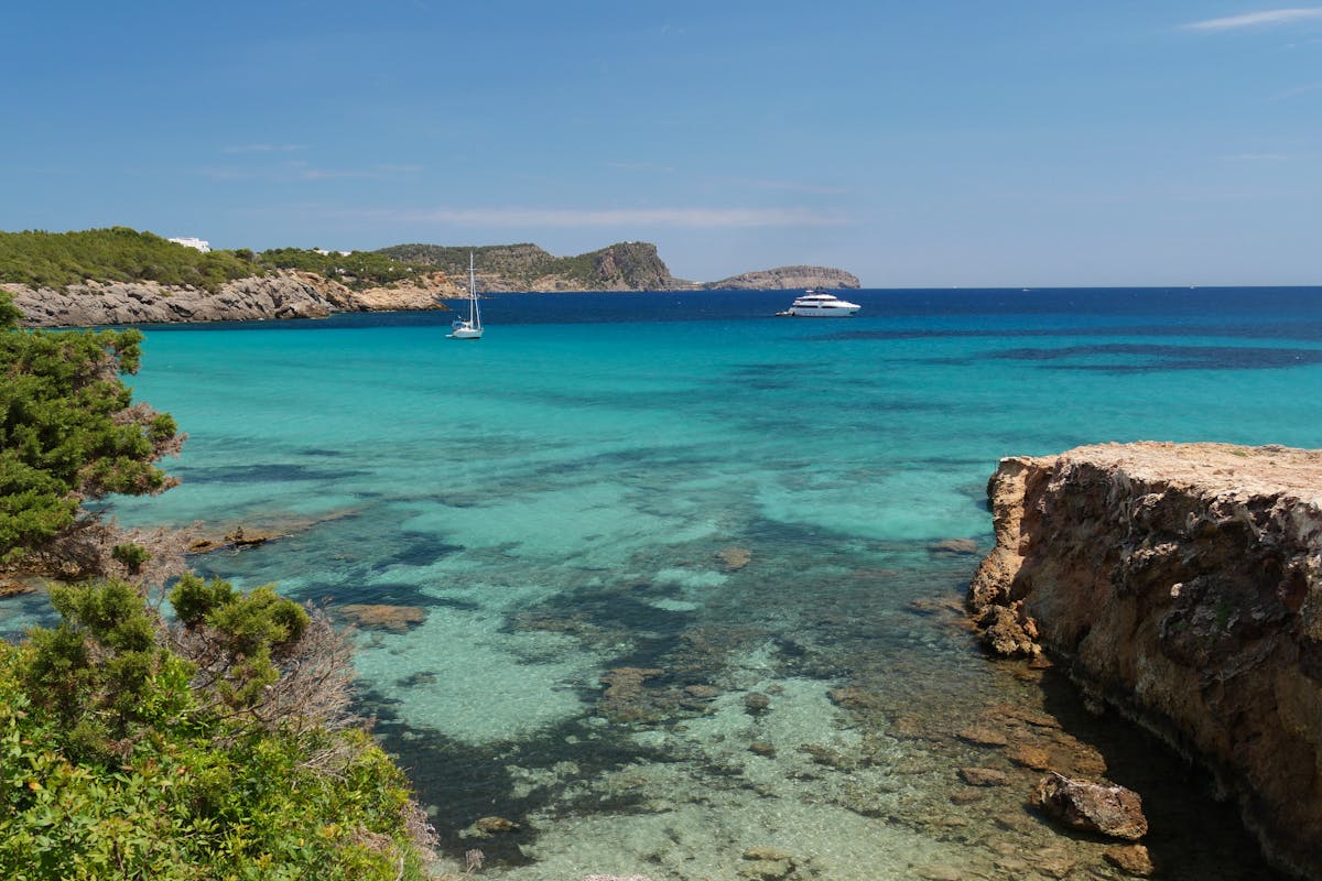 The turquoise waters and scenic coastline at Cala Nova beach in Ibiza
